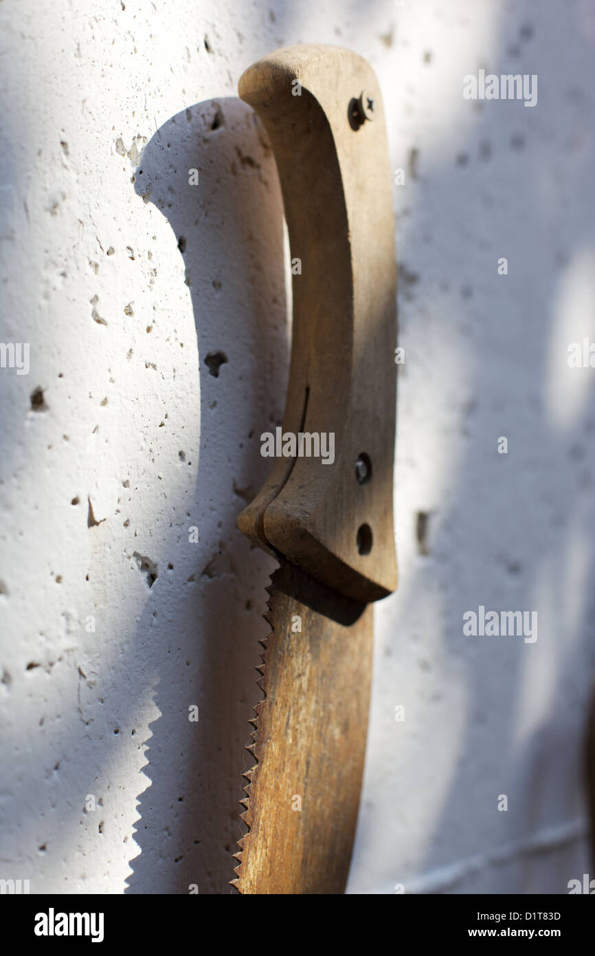 Old, rusting, farm tools hanging on a wall Stock Photo - Alamy