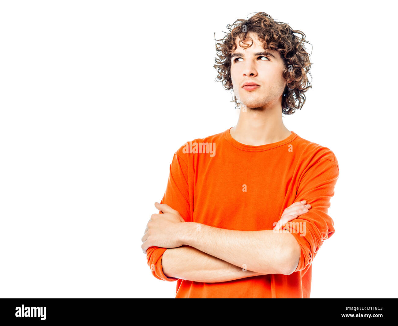 one young man suspicious looking up portrait in studio white background ...