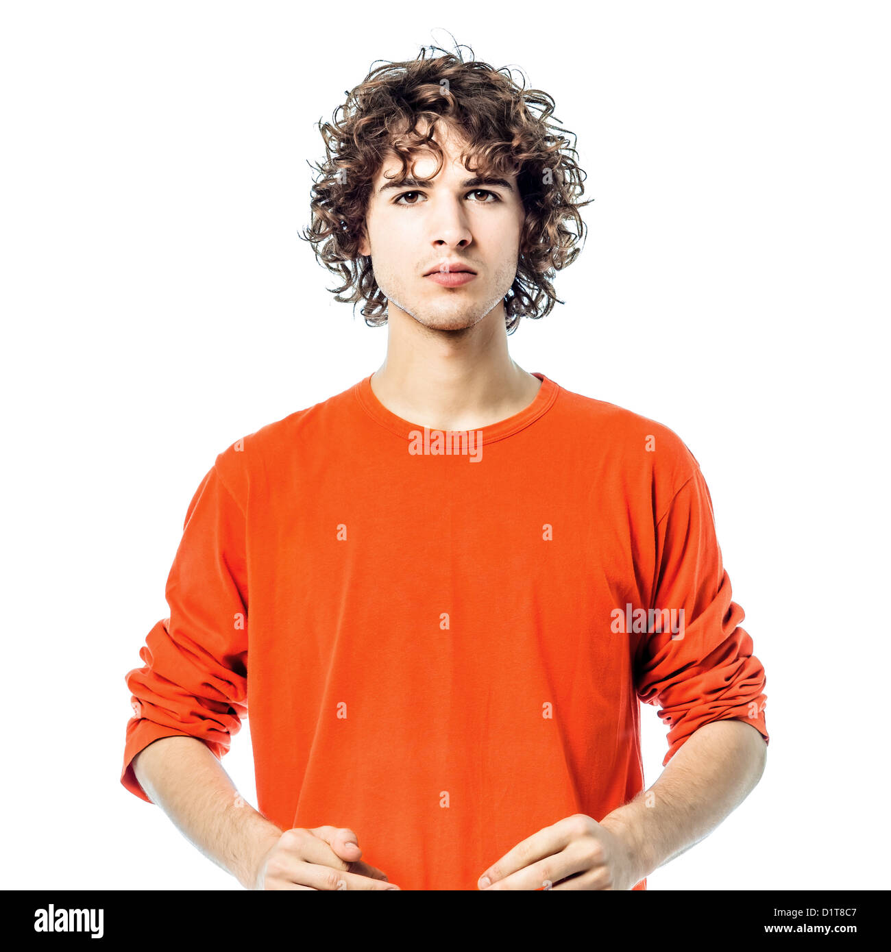 one young man serious looking at camera portrait in studio white ...