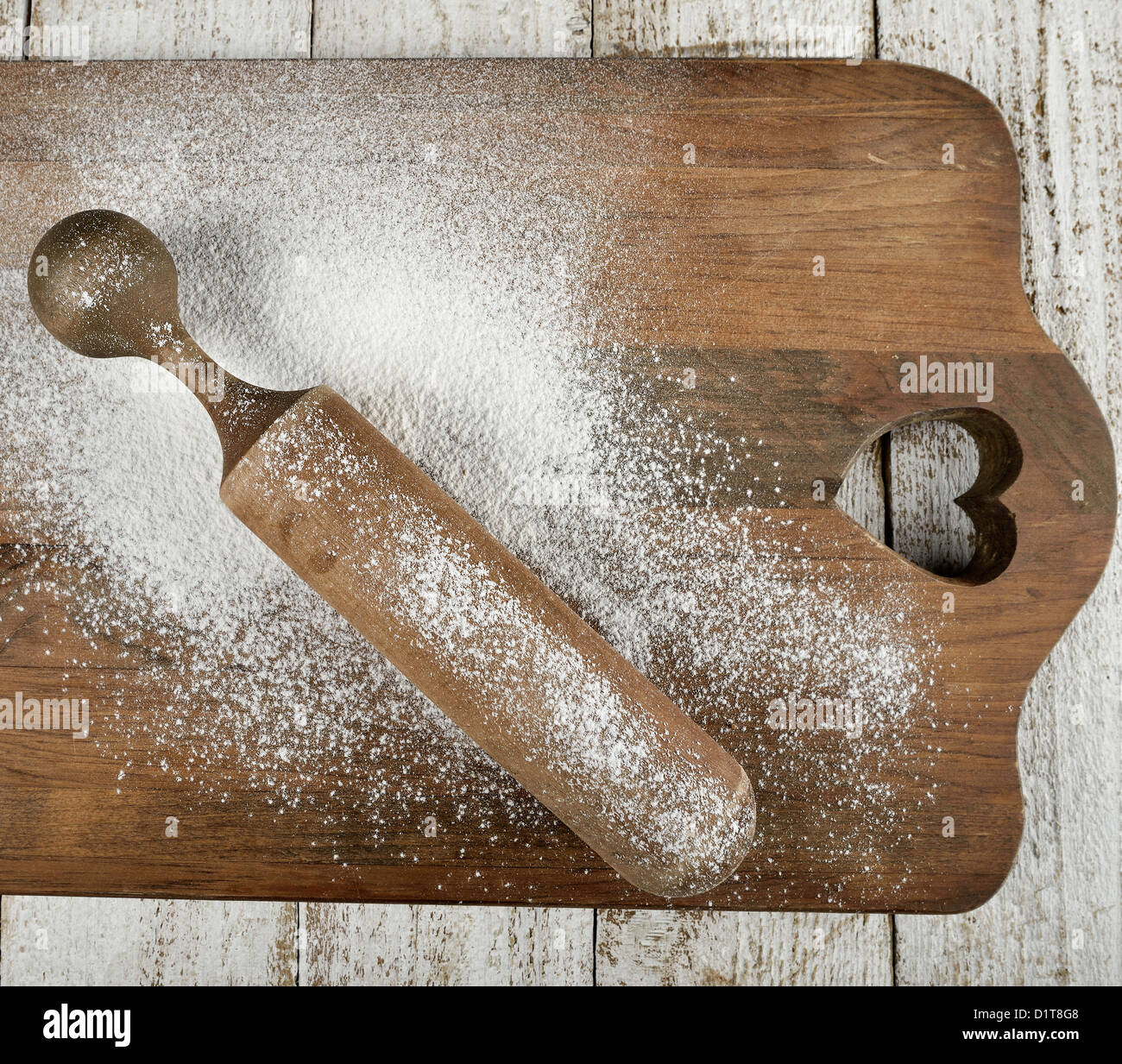 Wooden Rolling Pin With Flour On A Wooden Board Stock Photo - Alamy