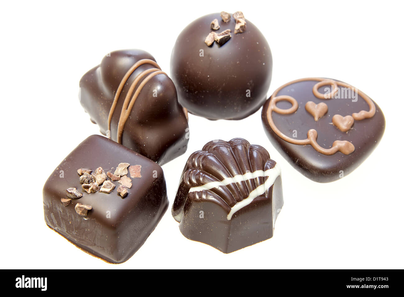 Dark Chocolate Assortment with Truffles Heart Swirls Nuts Isolated on ...