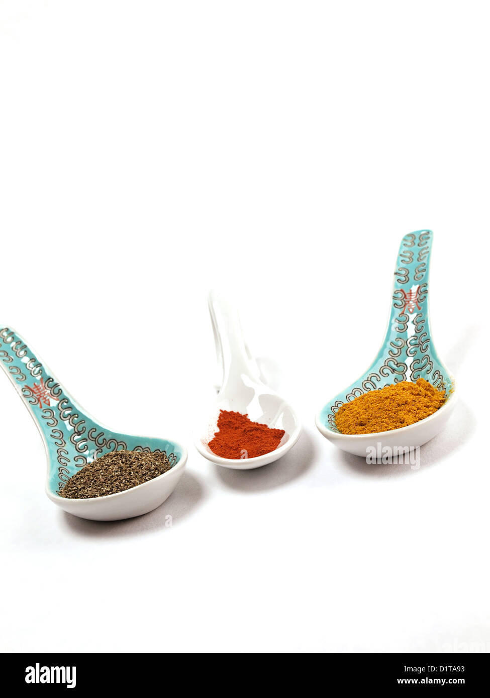 Asian spoon with spices Stock Photo - Alamy