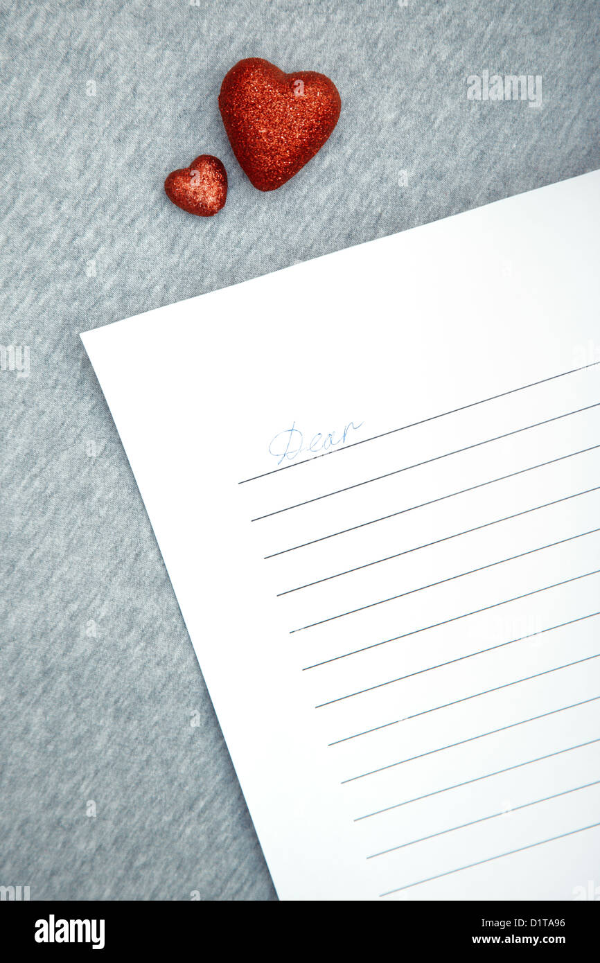 Two small hearts and love letter for Valentine Day Stock Photo - Alamy