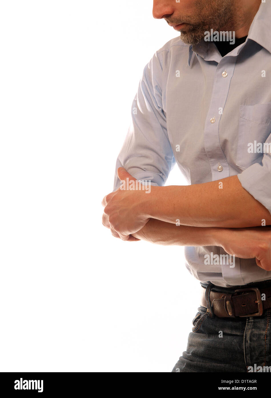 Man holding his elbow Stock Photo - Alamy