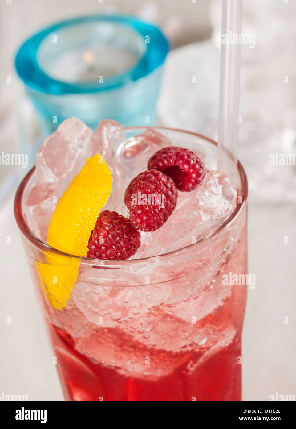 Red drink with raspberries and ice, focus Stock Photo - Alamy