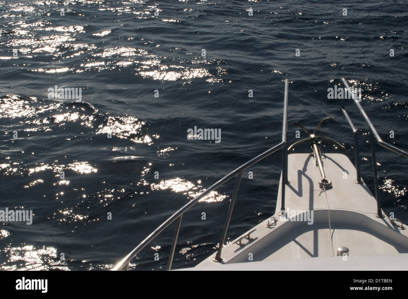 Bow of a dive boat with the sun reflecting off the ocean, Baa Atoll ...