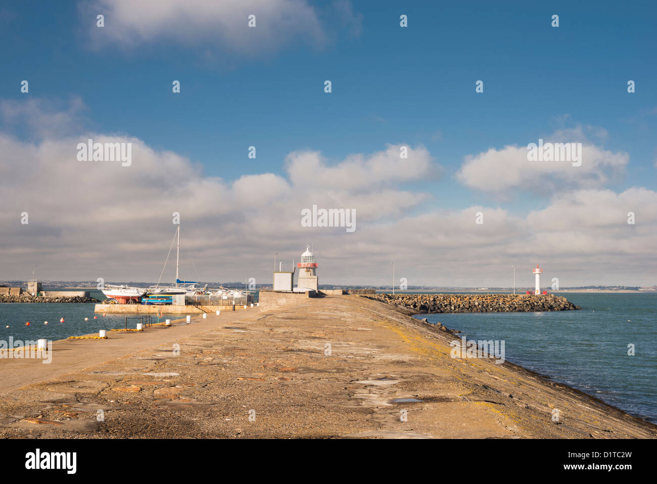 The pier and harbour entrance at the fishing town of Howth, Dublin ...