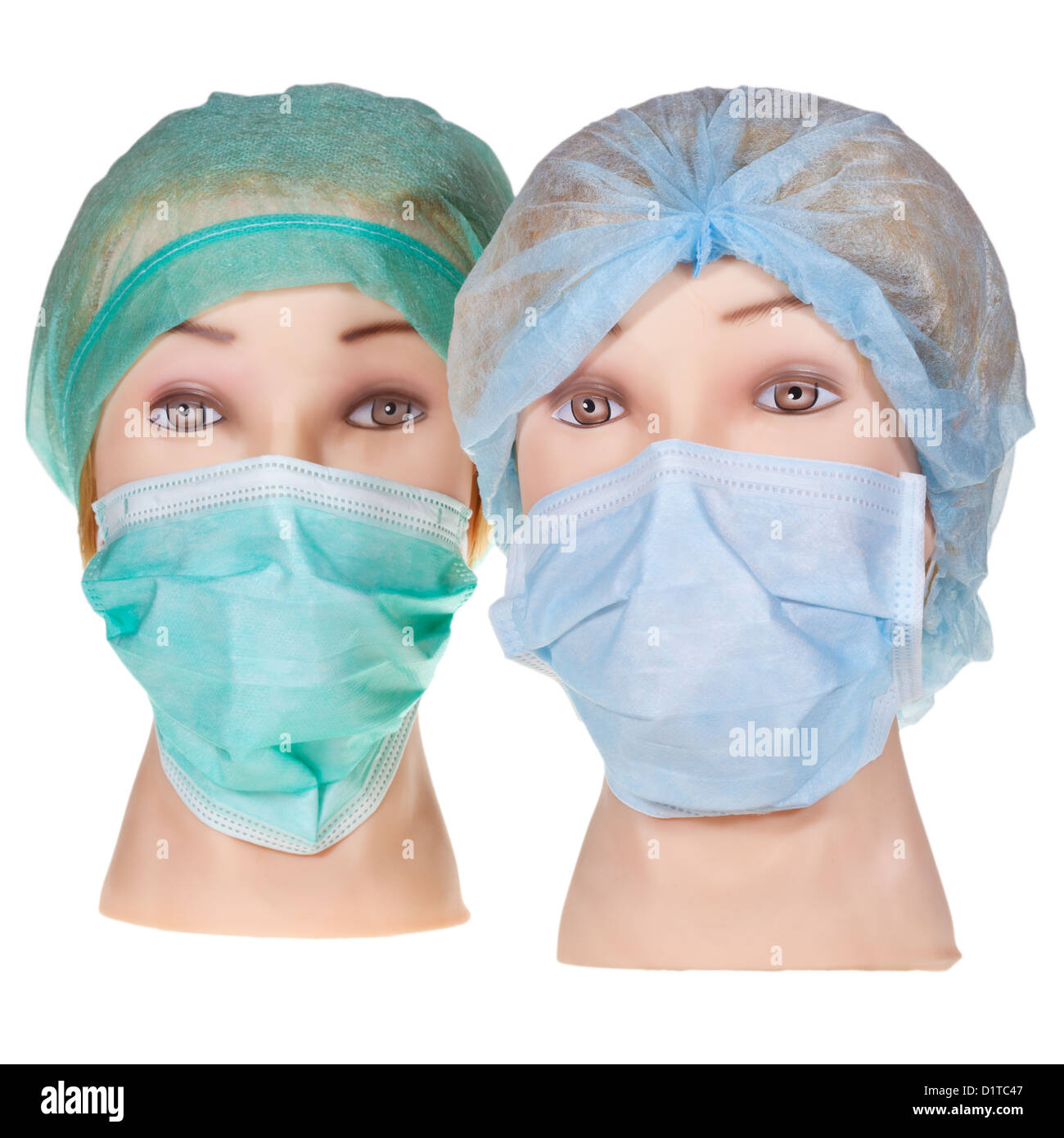 two female dummy doctor heads wearing textile surgical cap and medical ...