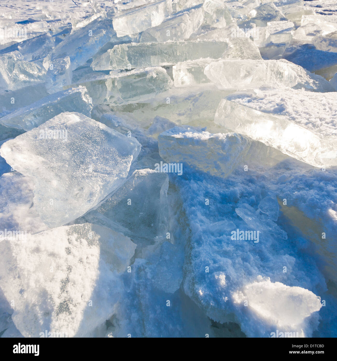 block of clear river ice in cold winter day under sunbeams in Moscow ...