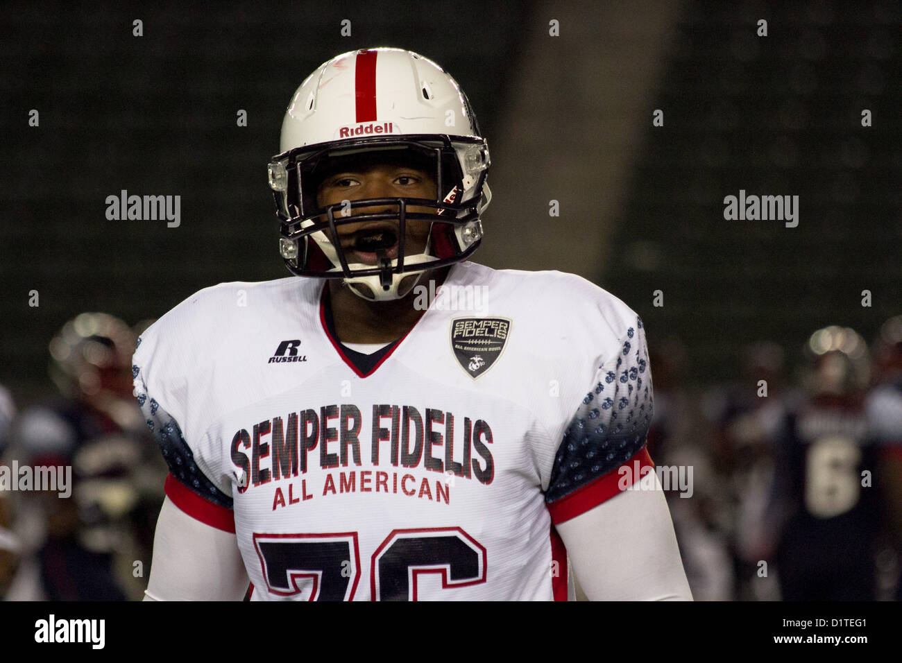 Kenneth Lacy, an offensive tackle from Phoenix, Arizona, runs off the ...