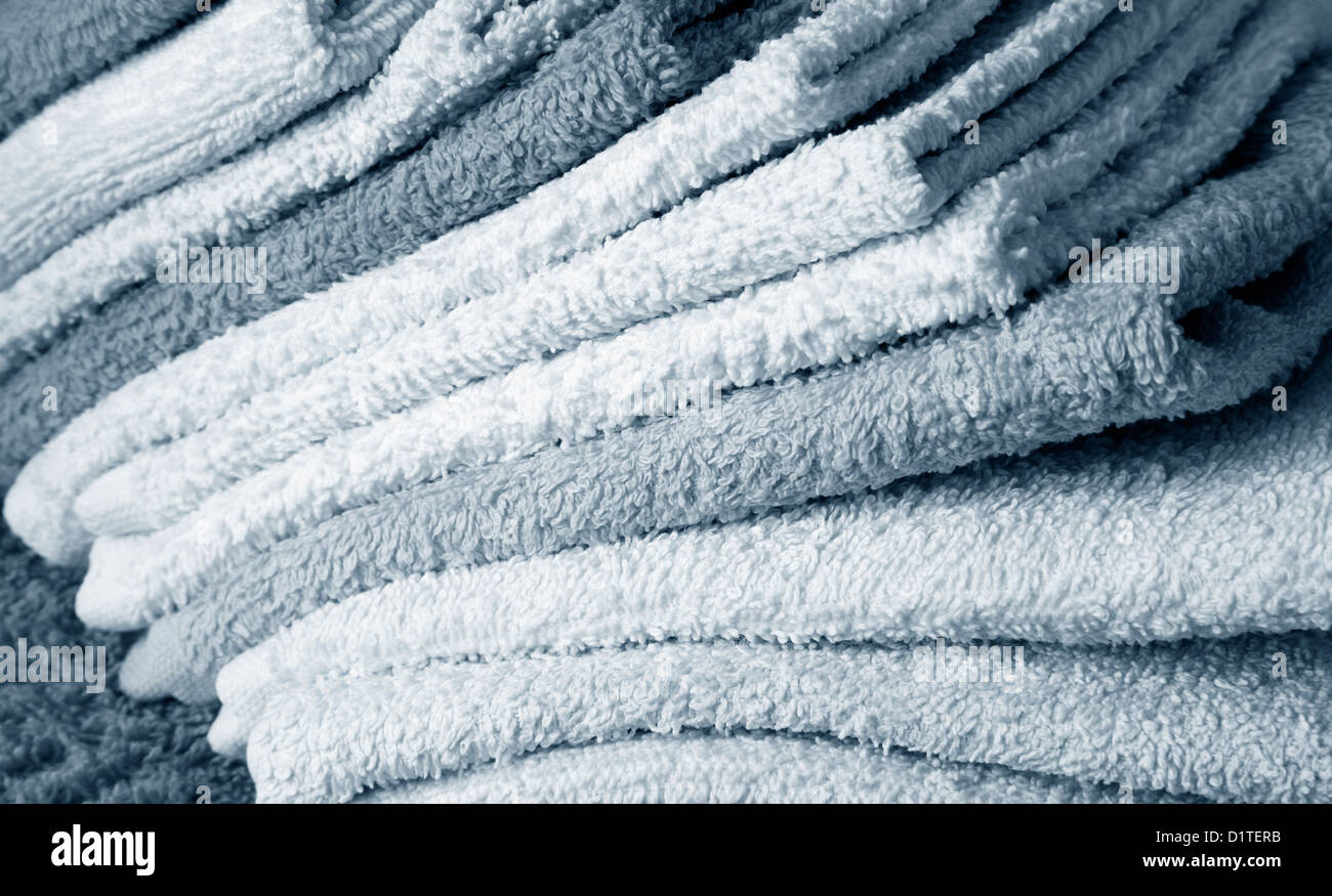 Stacked bath towels close-up. B/w + blue tone Stock Photo - Alamy