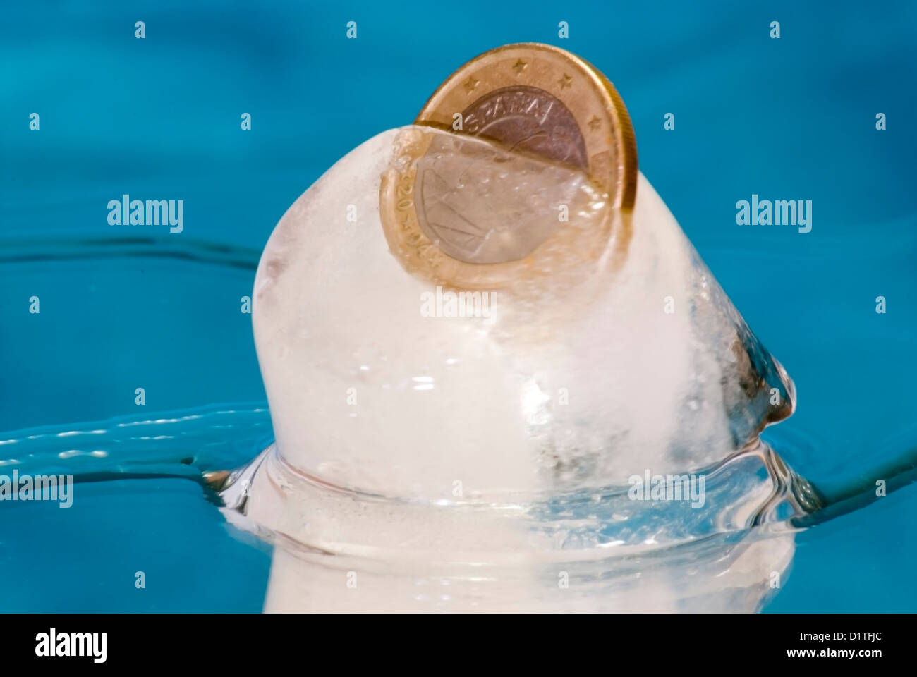 One euro currency frozen in an ice cube Stock Photo - Alamy