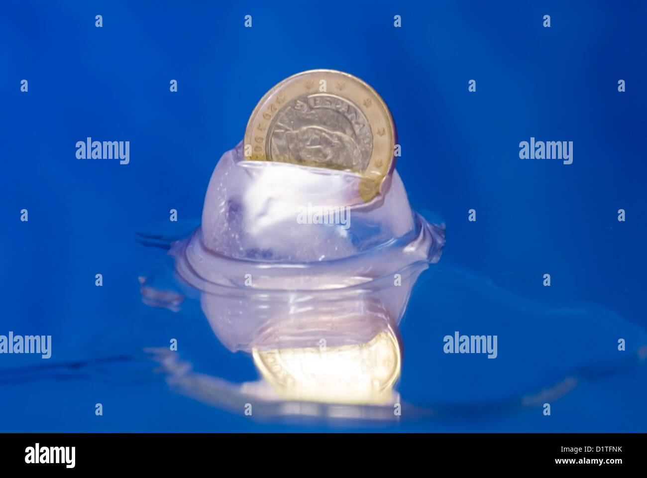 One euro currency frozen in an ice cube Stock Photo - Alamy