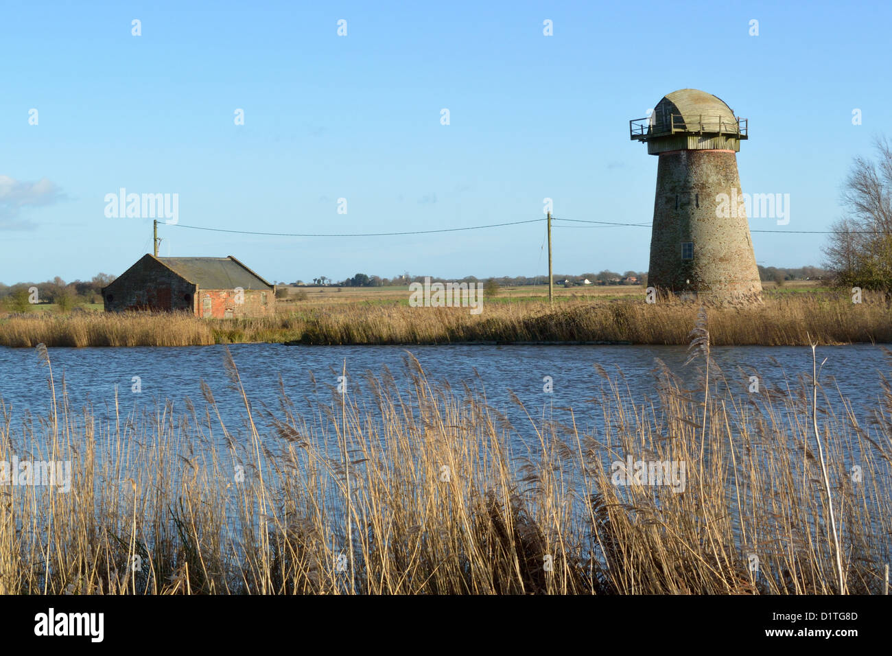 The River Bure near Acle, Norfolk, with derelict Clippesby Mill on the ...