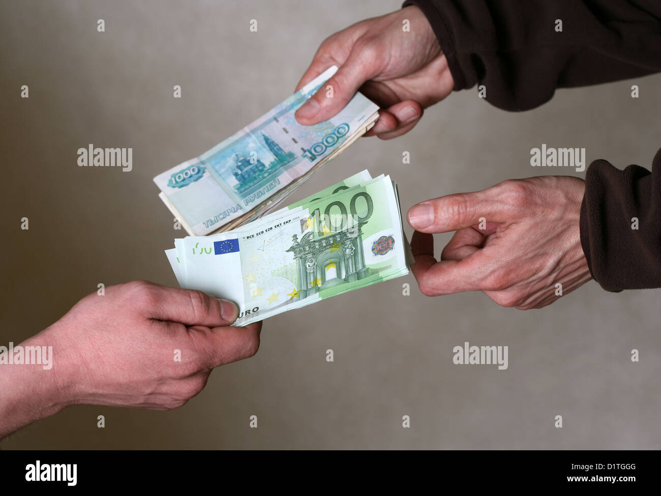Two men exchange money. Giving money concept Stock Photo - Alamy
