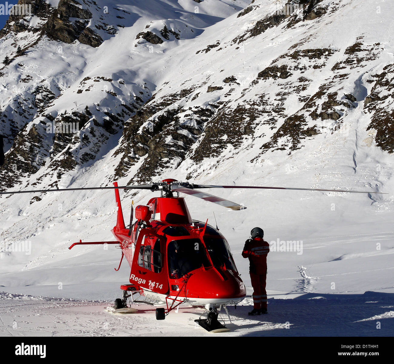 Rega emergency rescue helicopter landing on the ski slopes of Les ...