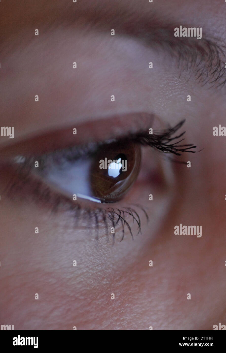Berlin, Germany, mirroring the Apple logo in the eye of a woman Stock ...