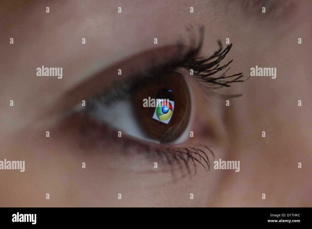 Berlin, Germany, mirroring the Google Chrome logo in the eye of a woman ...