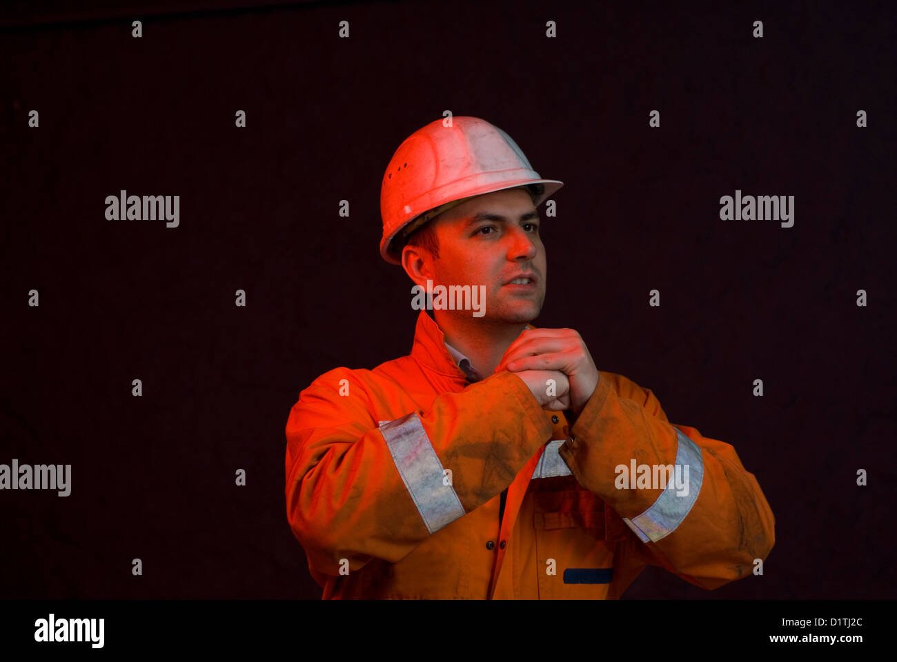 Concept strength: Worker in uniform showing positive attitude for ...