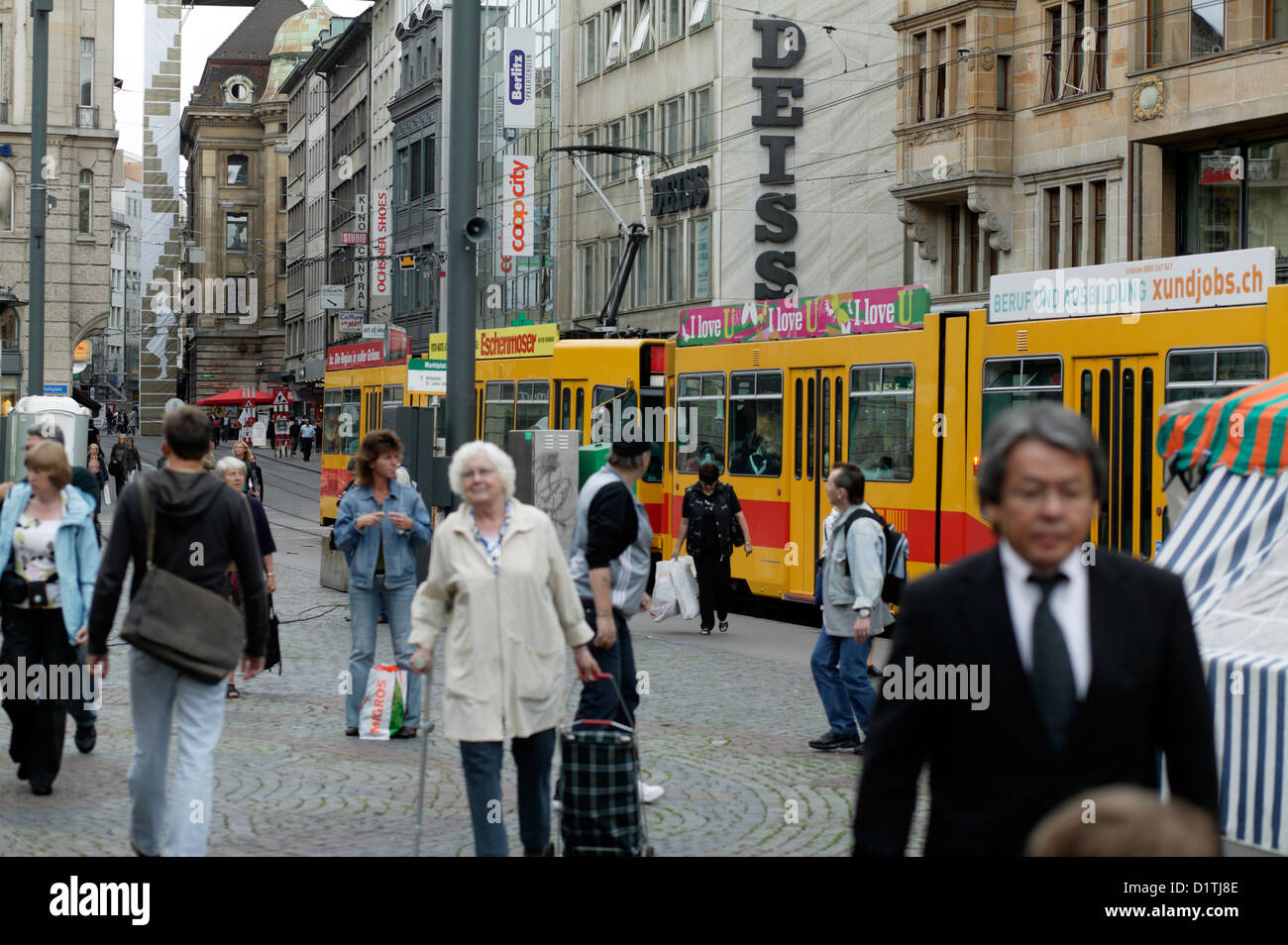Basel, Switzerland, pedestrians and tram at the stop at the market ...