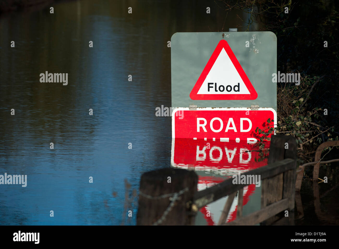 Flooded road and warning sign Stock Photo - Alamy