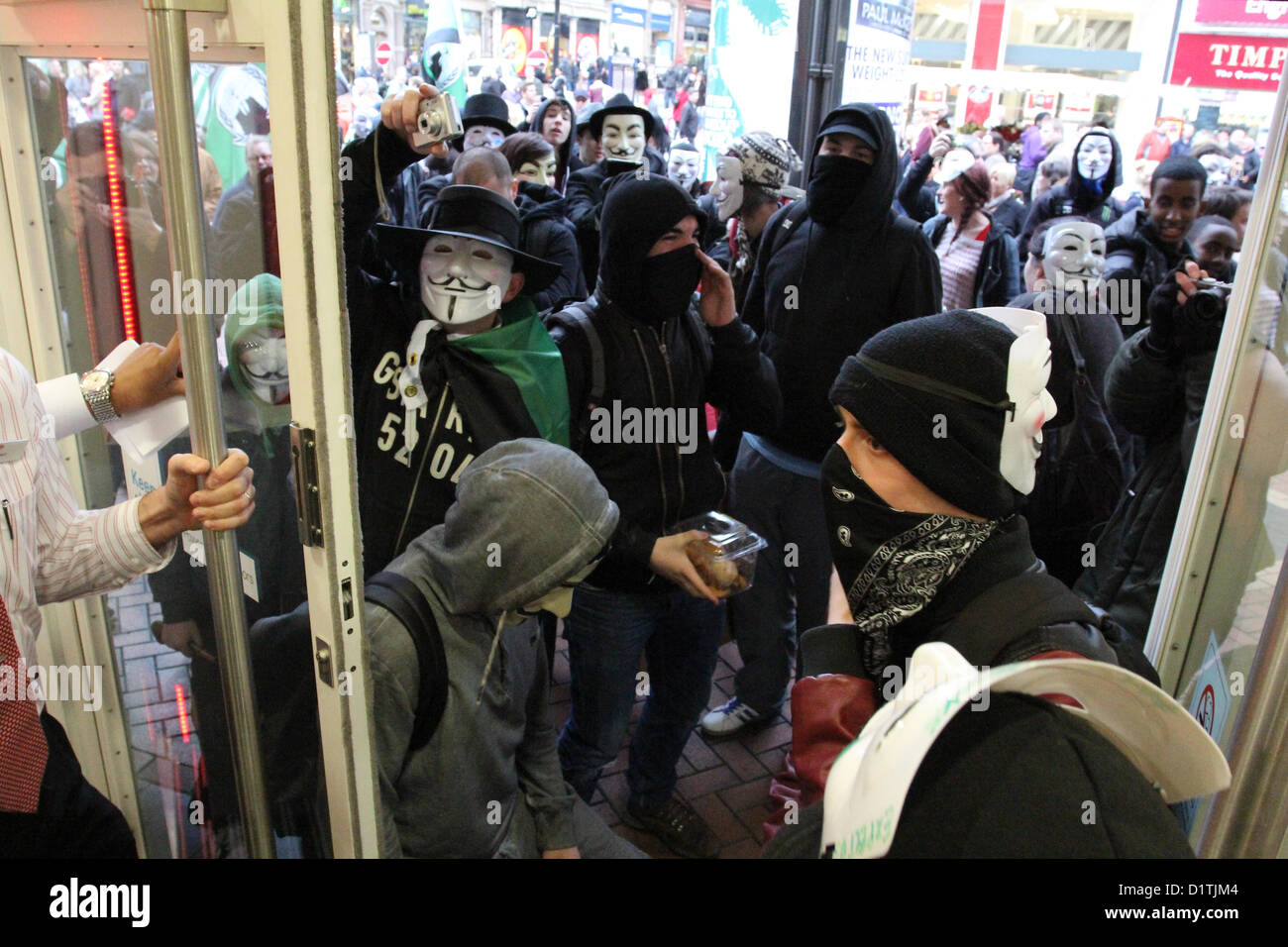 Campaigners from Anonymous and UK Uncut target outlets in Birmingham ...