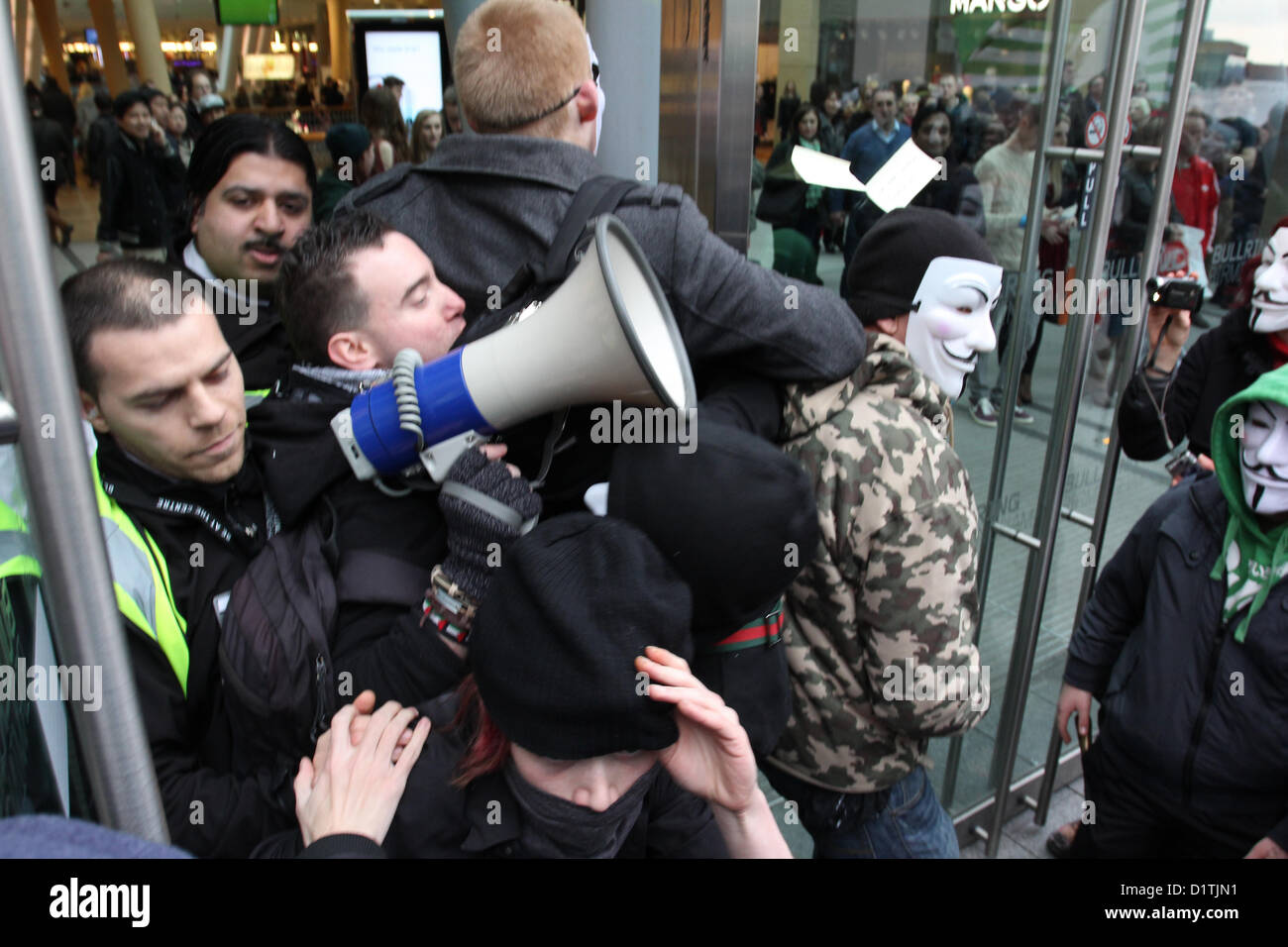 Campaigners from Anonymous and UK Uncut target outlets in Birmingham ...