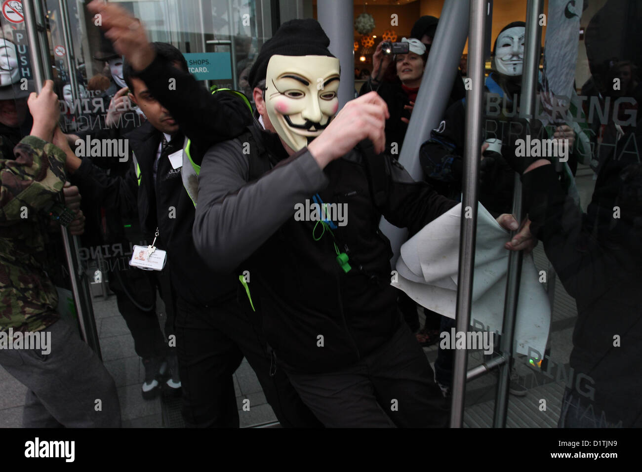 Campaigners from Anonymous and UK Uncut target outlets in Birmingham ...