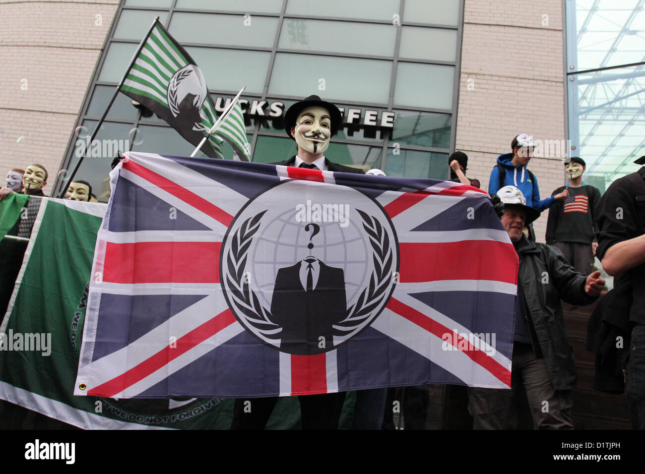 Campaigners from Anonymous and UK Uncut target outlets in Birmingham ...