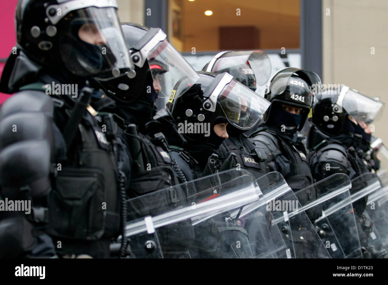 Belfast, UK. 5th Jan, 2013. A line of PSNI officers in riot gear, at ...
