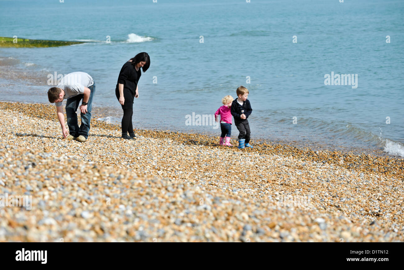 Boy throwing pebbles into the sea hi-res stock photography and images ...