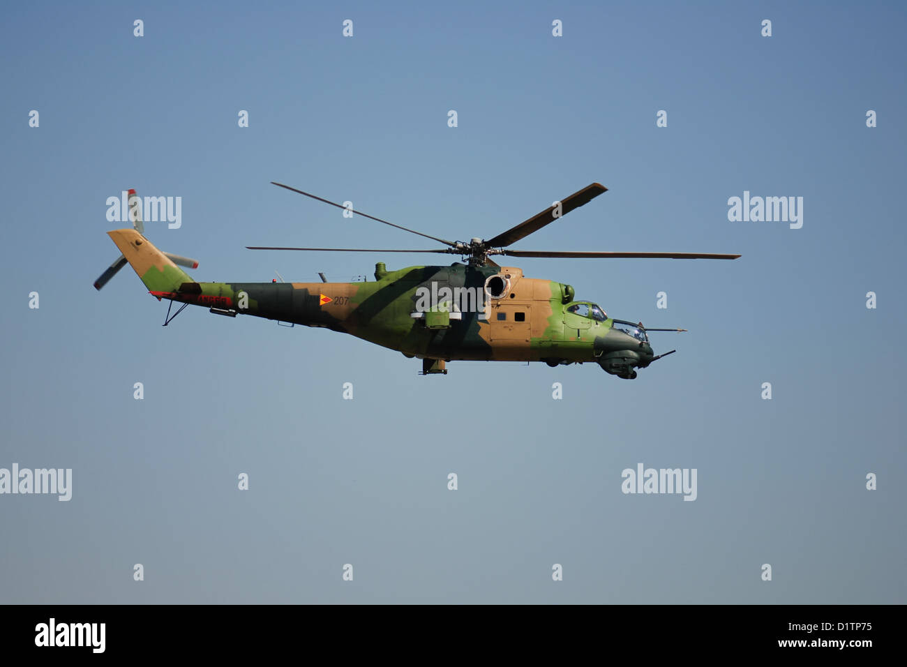 Side shot of aa army chopper in flight isolated on blue sky Stock Photo ...