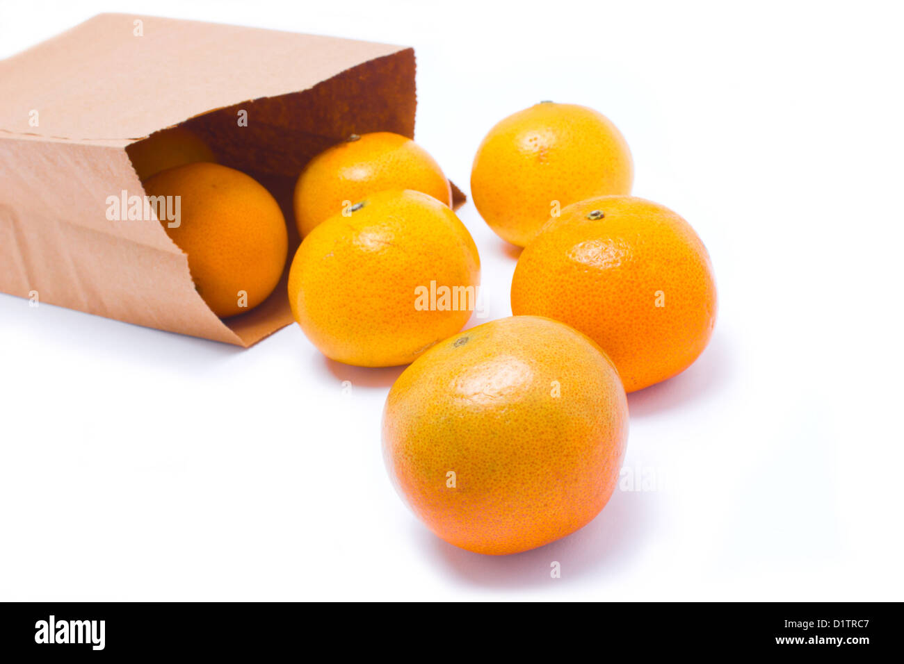 Six oranges falling from paper bag, isolated on white background Stock ...