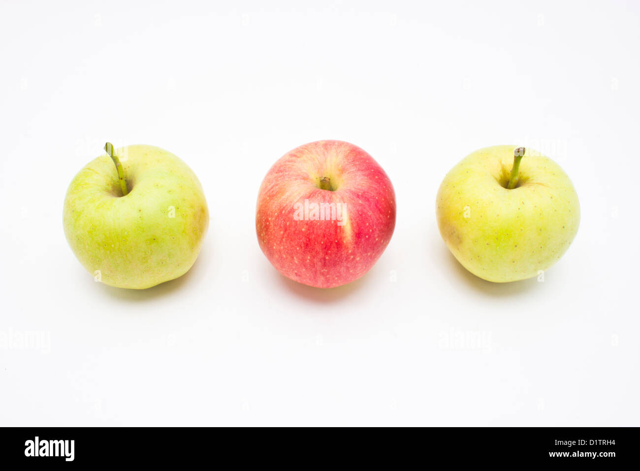 Red apple among green apples isolated on white background Stock Photo ...