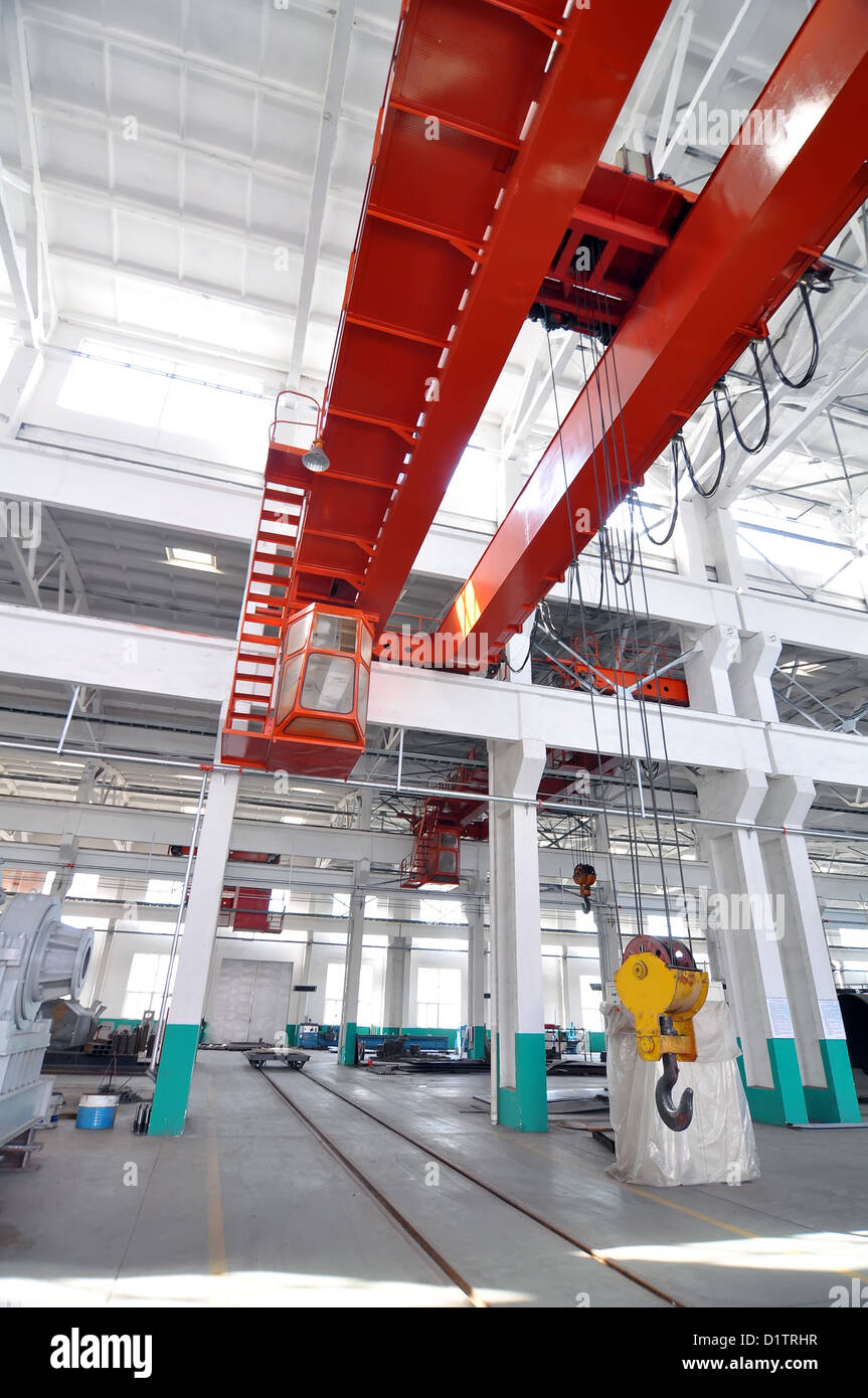 Tower crane in the factory workshop Stock Photo - Alamy