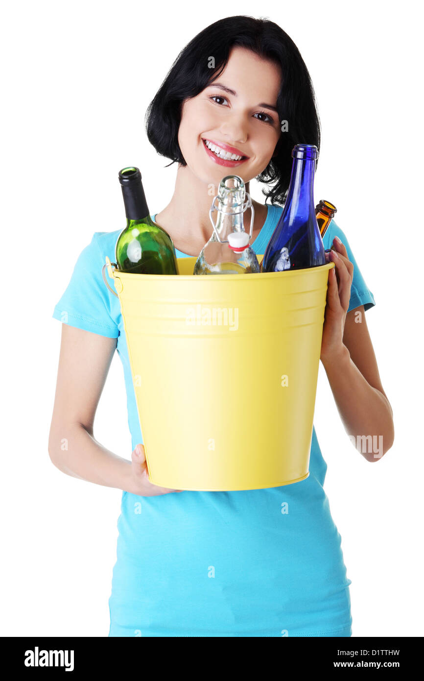 Beautiful young woman holding recycling bin isolated on white ...