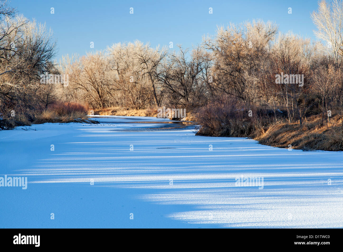 frozen Cache la Poudre River in Fort Collins, Colorado with shadow ...