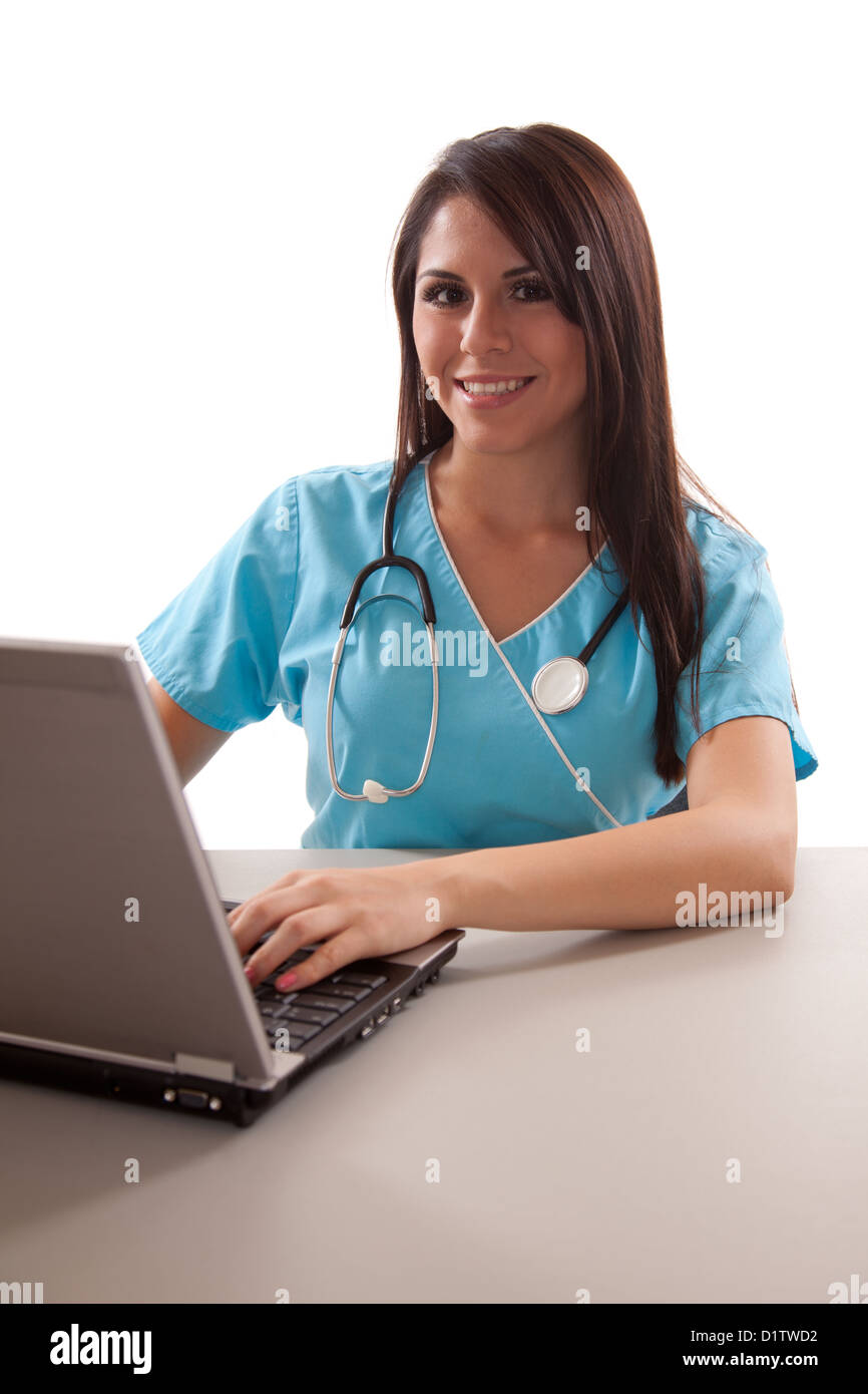 Young hispanic nurse working on computer Stock Photo - Alamy