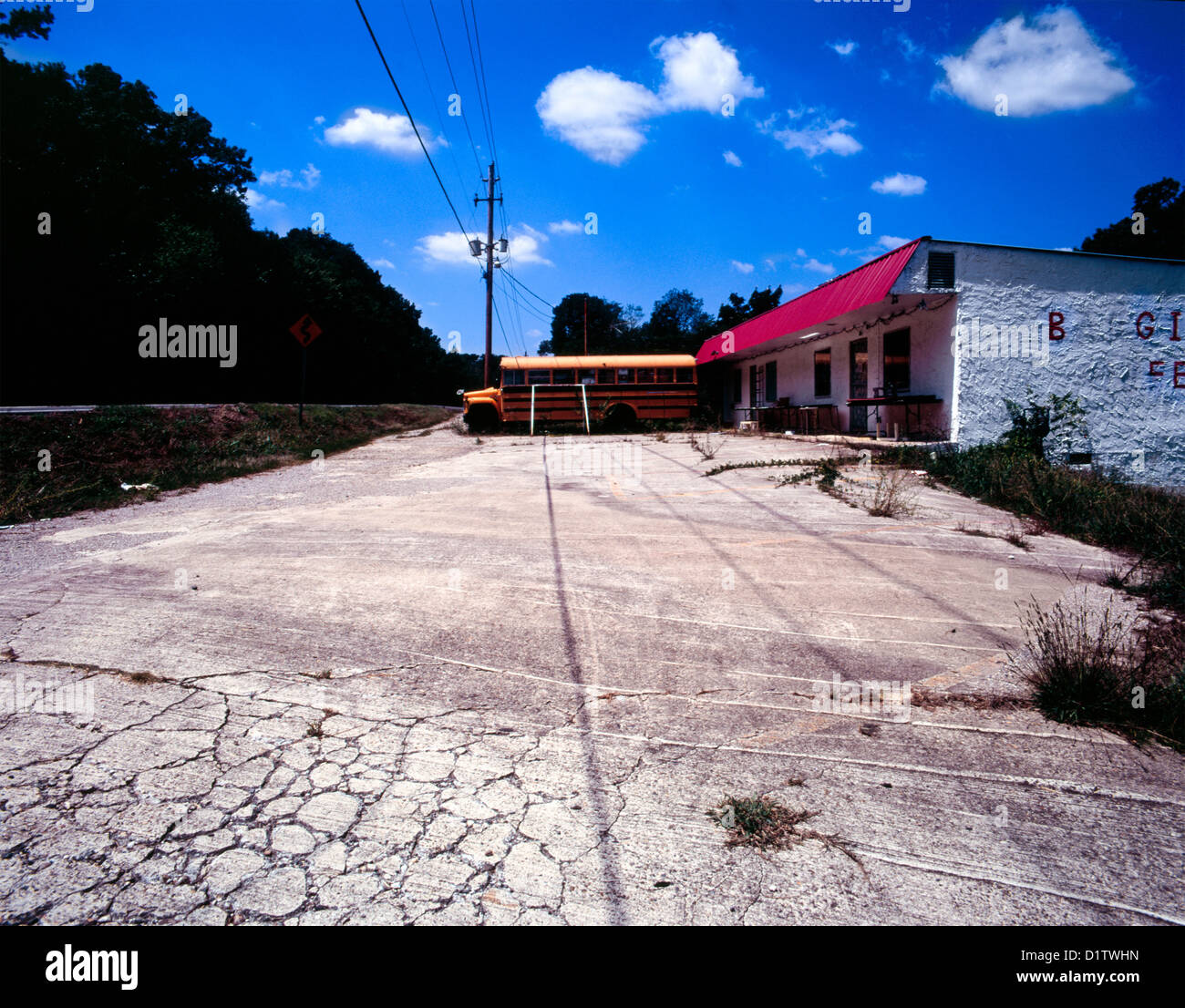 Yellow school bus parked on Route 66, USA Stock Photo - Alamy