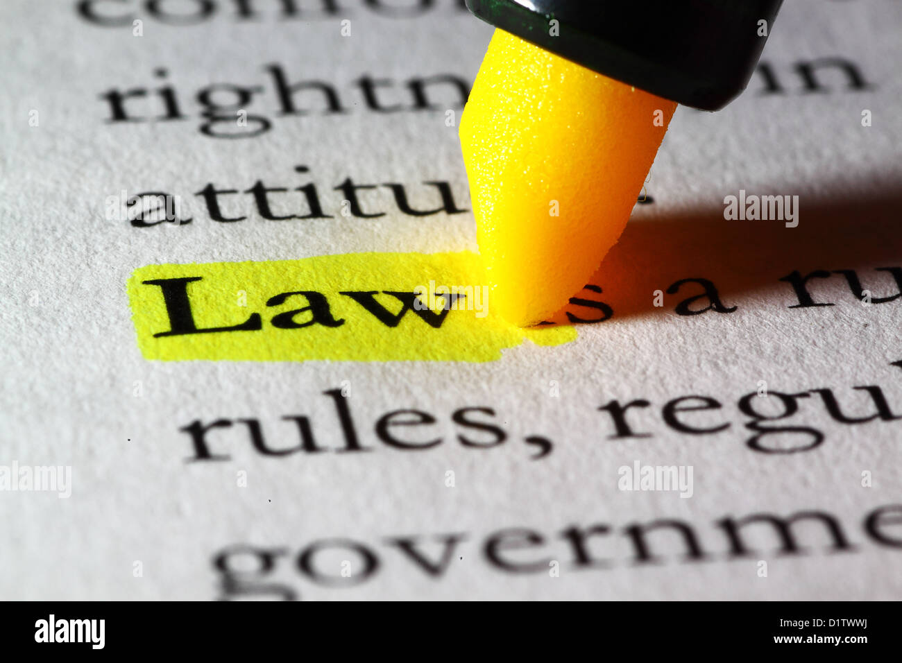 Word law highlighted with a yellow marker Stock Photo - Alamy