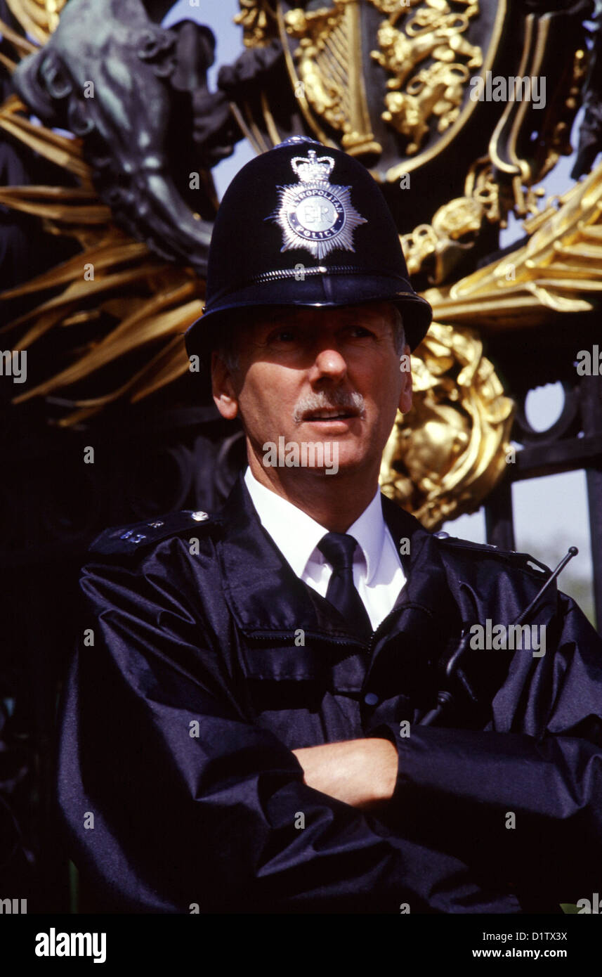 A British policeman wearing typical Custodian helmet or centurion ...