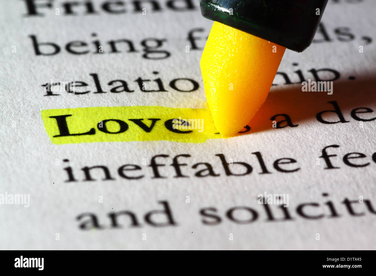 Word love highlighted with a yellow marker Stock Photo - Alamy