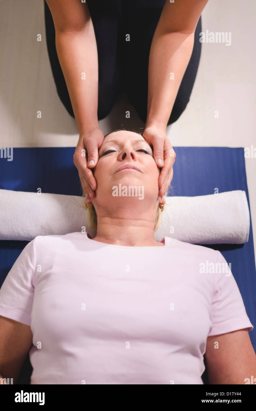 Alternative traditional medicine and massage, young spirit healer doing ...