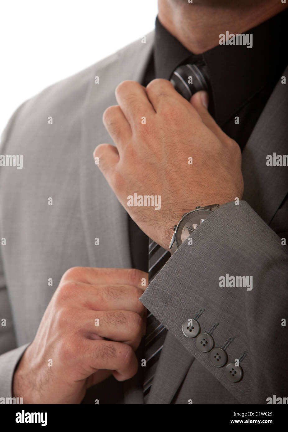 Hands fixing tie Stock Photo - Alamy