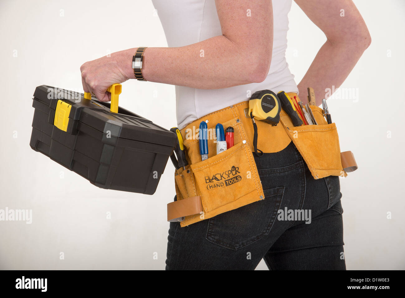 Woman wearing a tool belt and carrying a toolbox Stock Photo - Alamy