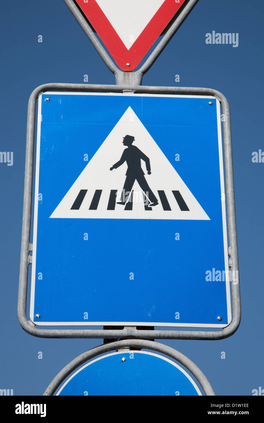 Pedestrian Crossing Sign against Blue Sky Background Stock Photo - Alamy