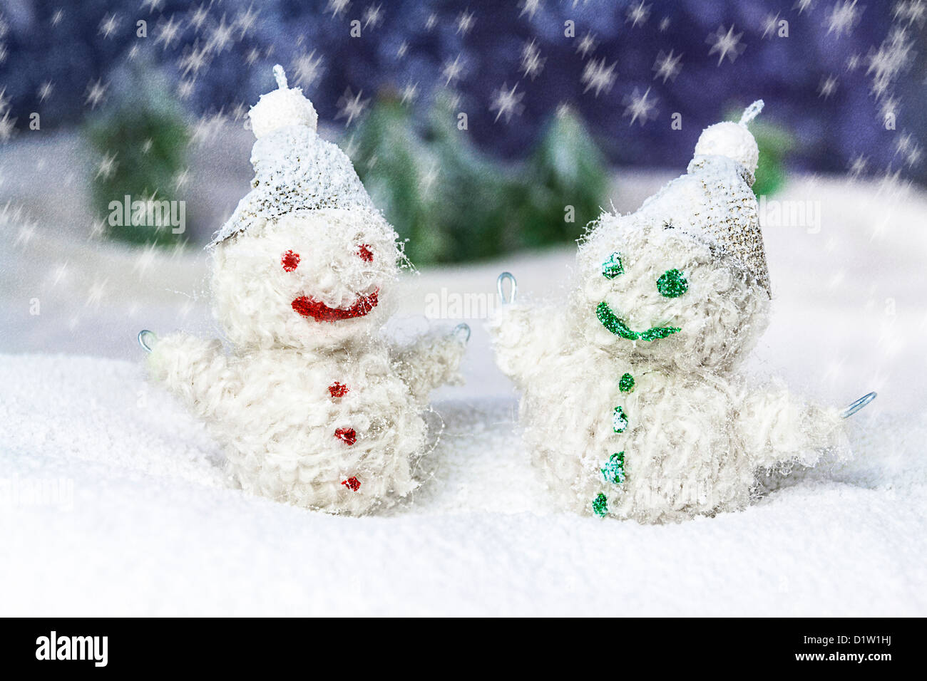 happy and smiling snowmen in the winter scenery Stock Photo - Alamy