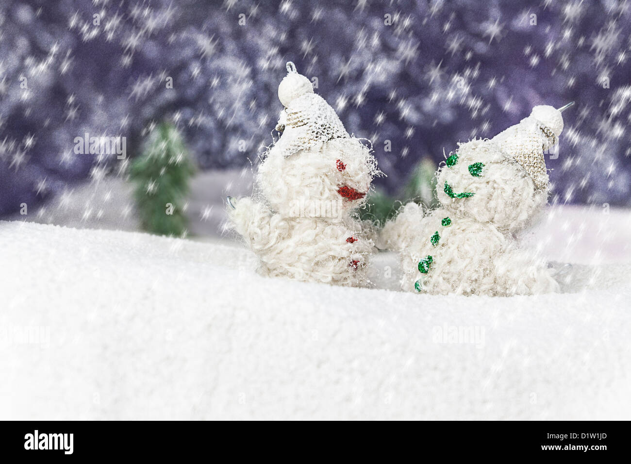 happy and smiling snowmen in the winter scenery Stock Photo - Alamy