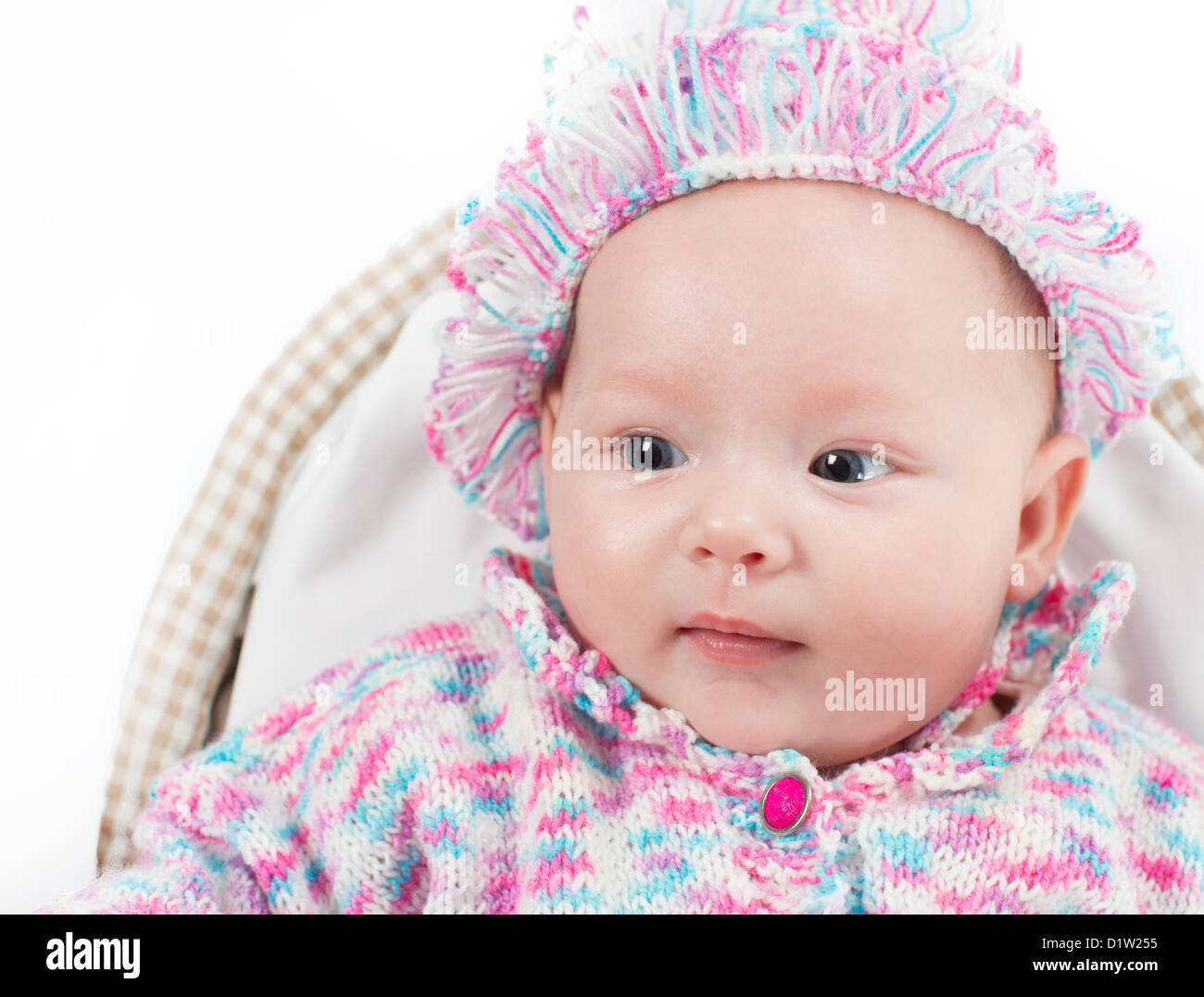 A cute little child. The baby could be a boy or girl and has blue eyes ...