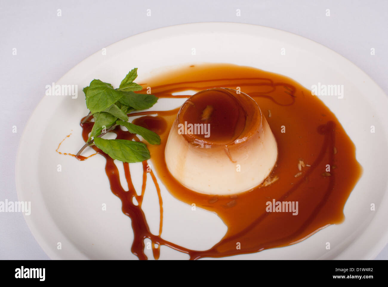 Spanish flan dessert served with sweet syrup, a traditional dessert ...